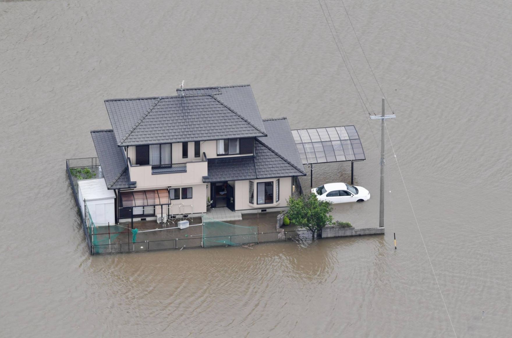 Heavy rain in northern Japan triggers floods and landslides, forcing ...