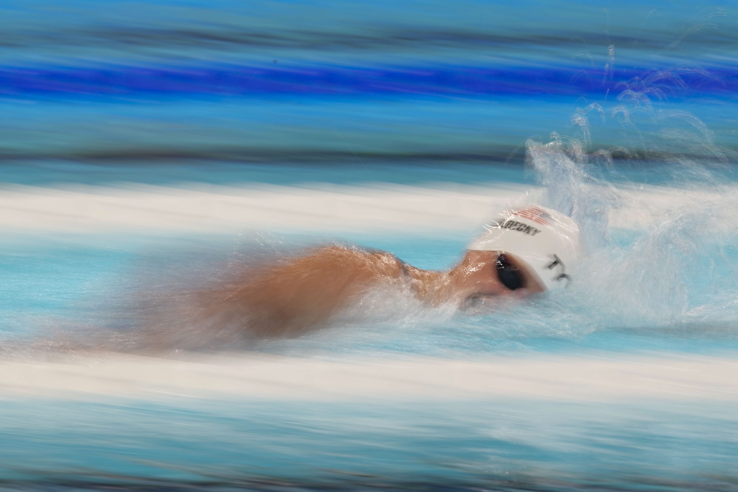 Olympic swimming: Ledecky is fastest in heats of 1500; Marchand ...