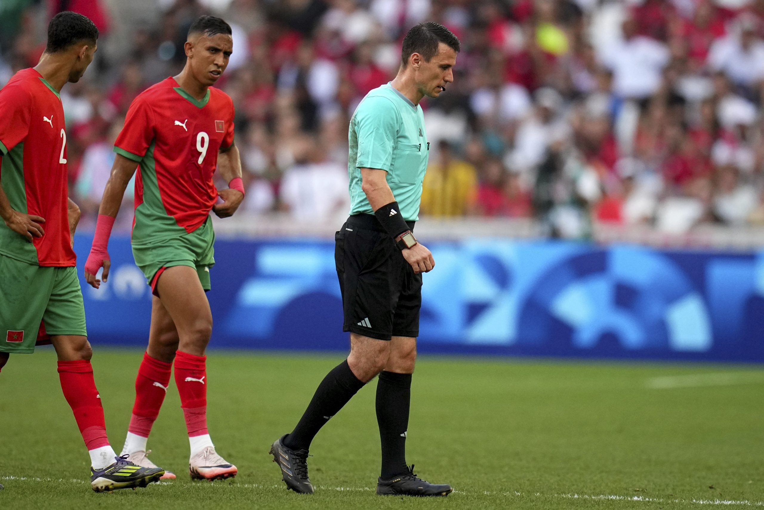 Referee injured in Morocco-Spain semifinal soccer game at Paris ...