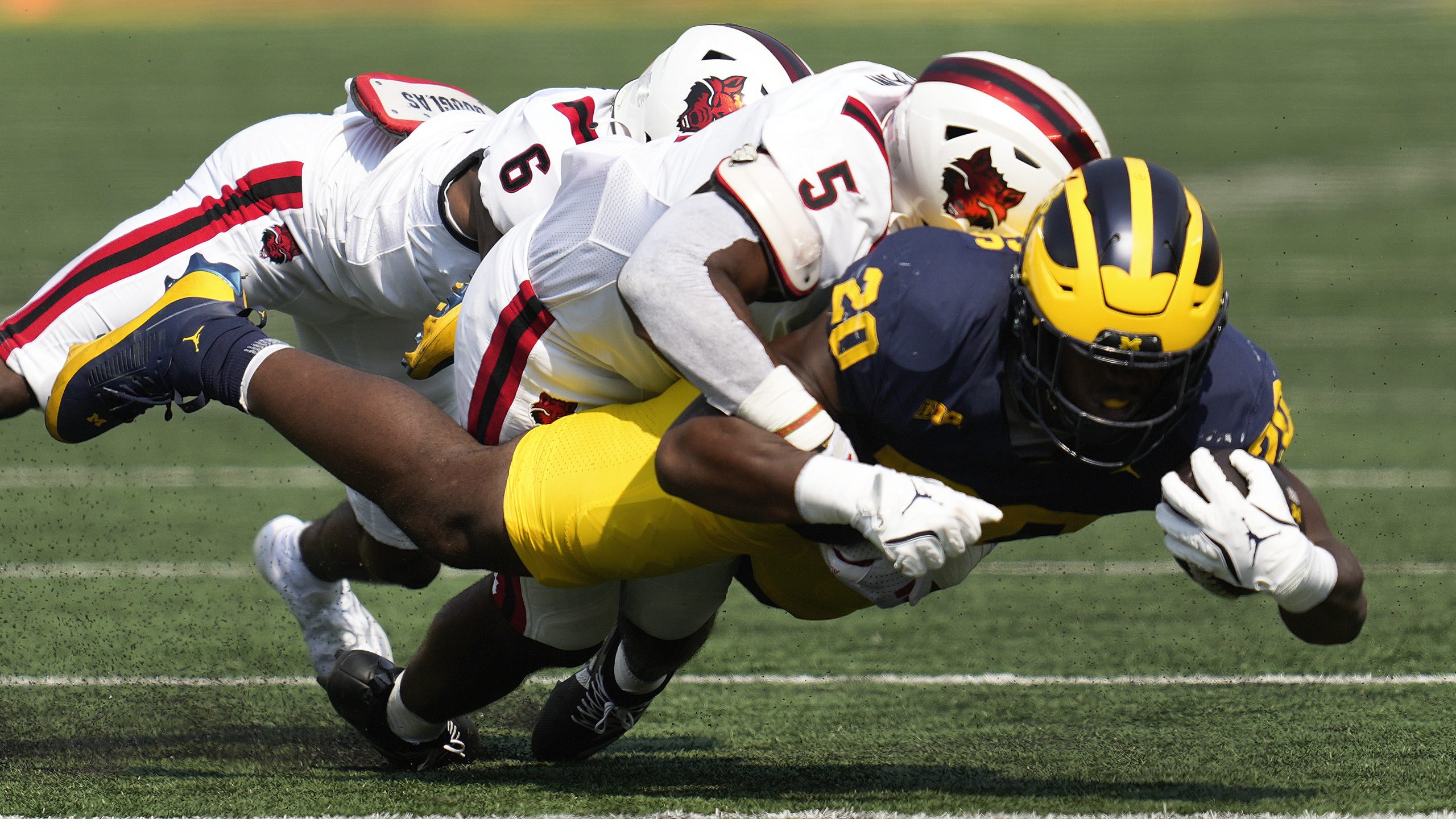No. 17 Michigan beats Arkansas State 28-18 on the ground, overcoming ...