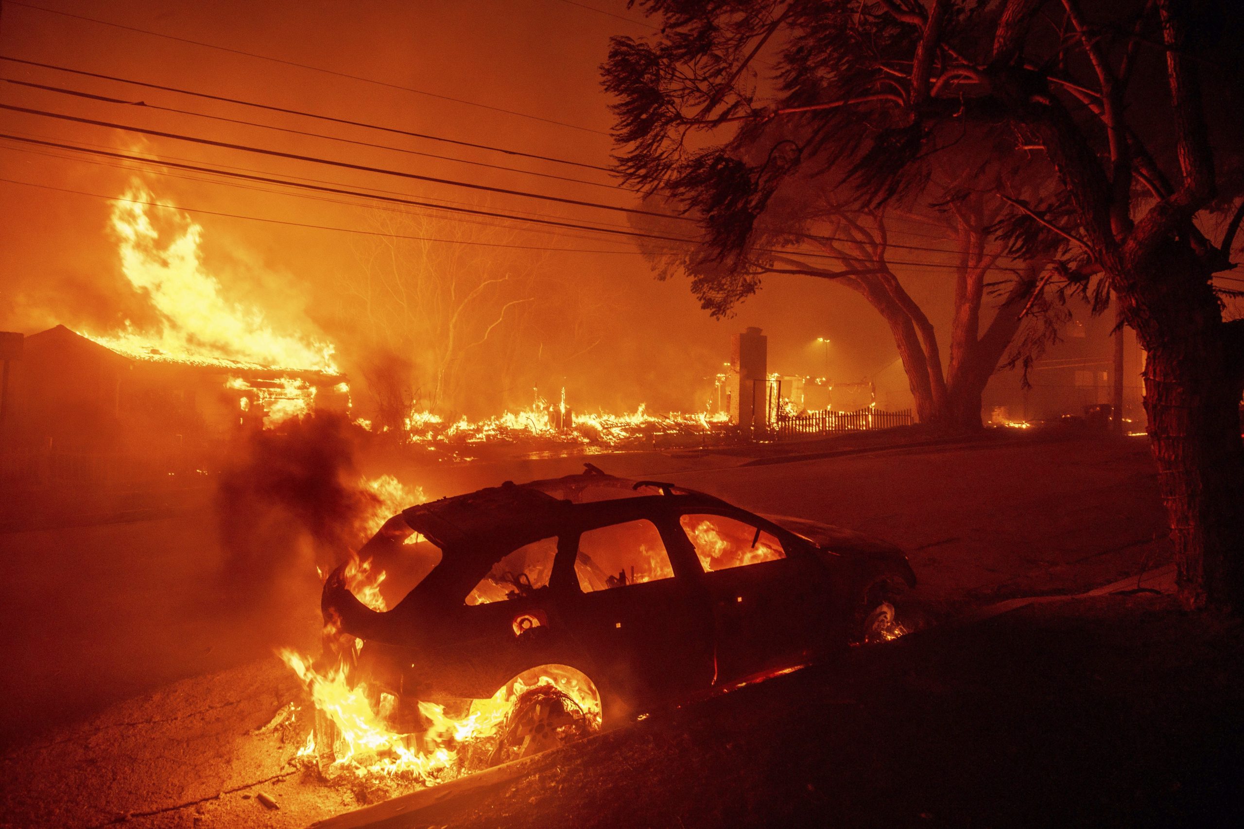 Firefighters race to contain Los Angeles wildfires with menacing winds ...