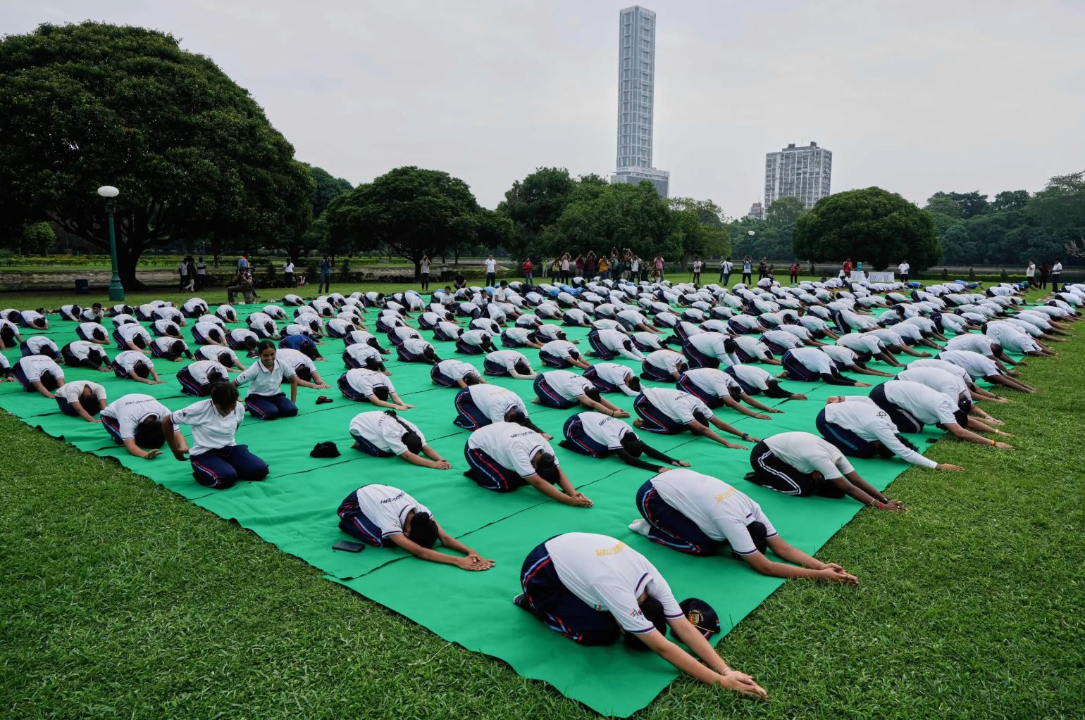 Indians stretch, breathe and balance to mark International Day of Yoga ...