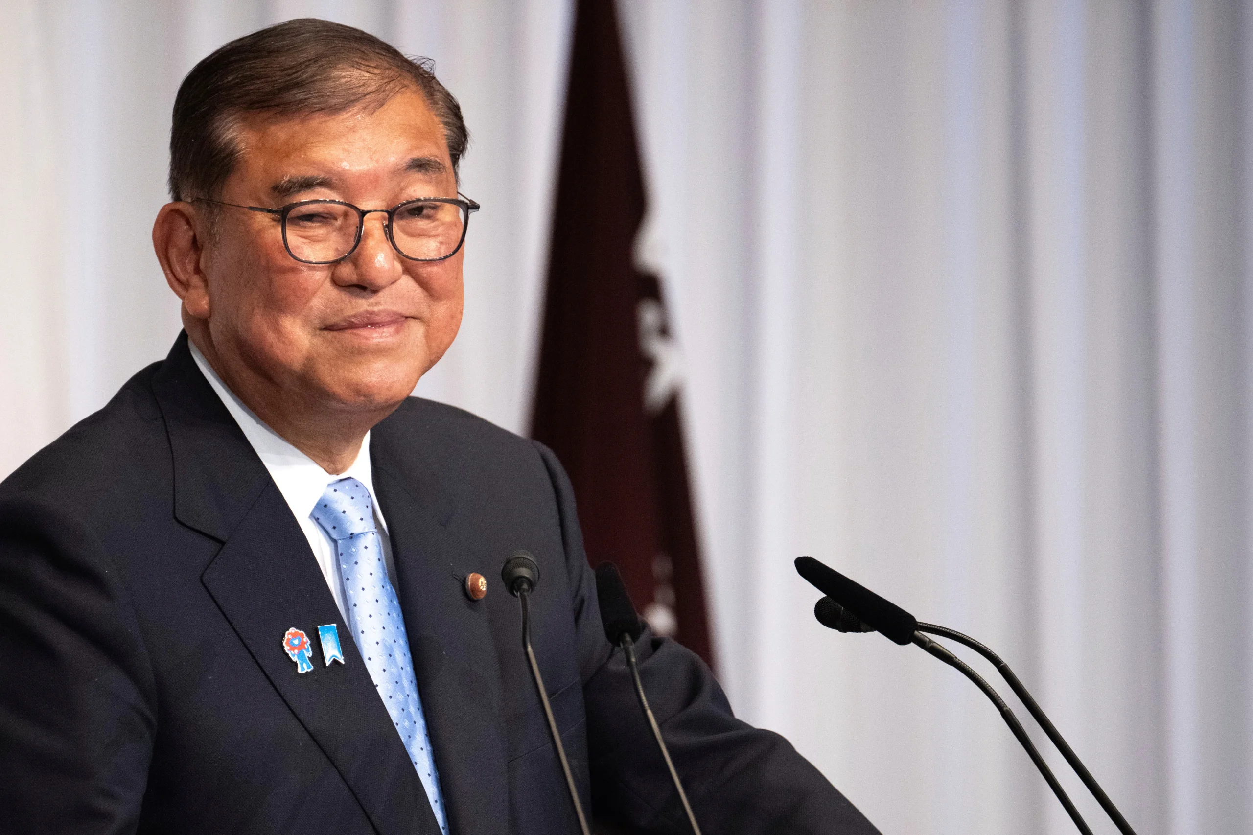 Japanese PM stays on to tackle high inflation and US tariffs despite a ...