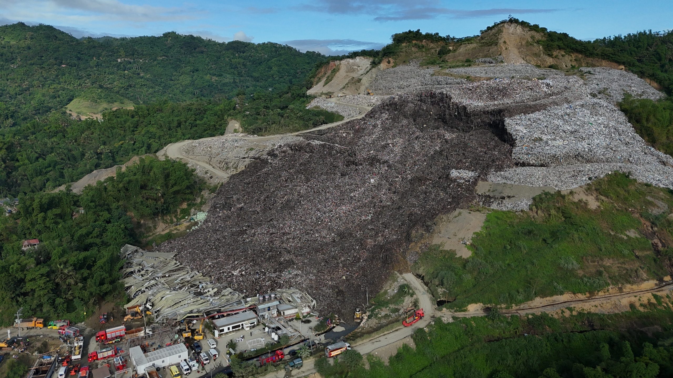 Mound of garbage collapses at Philippine landfill, killing 2 and ...