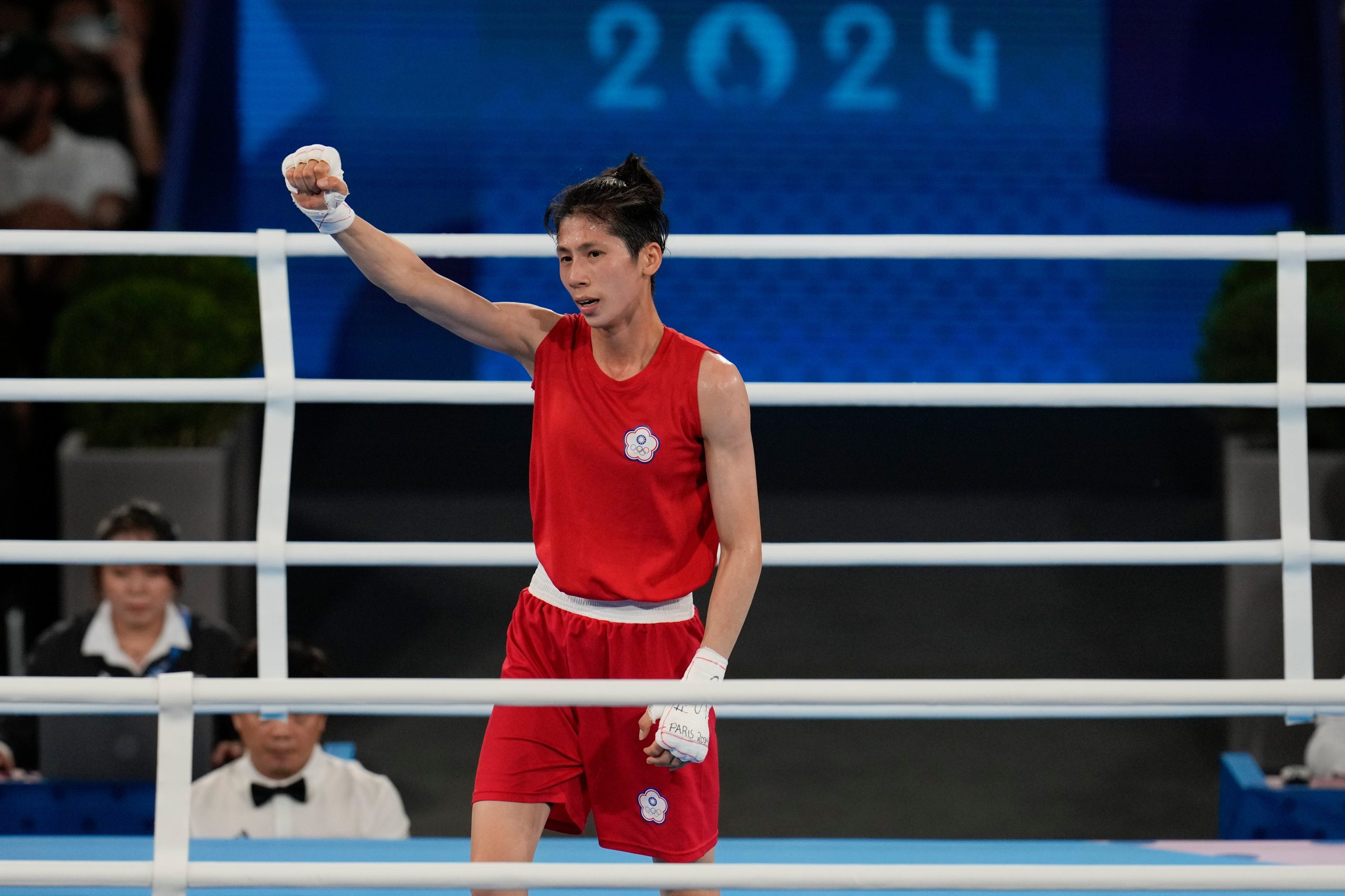 Taiwan Olympic boxing champ involved in gender debate wins first bout ...